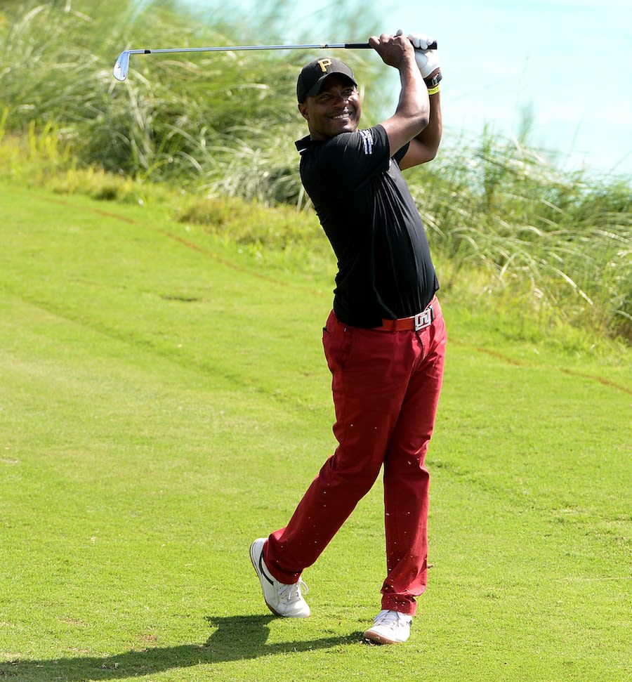 Brian Lara swings one over the top during a pro-am golf event ...