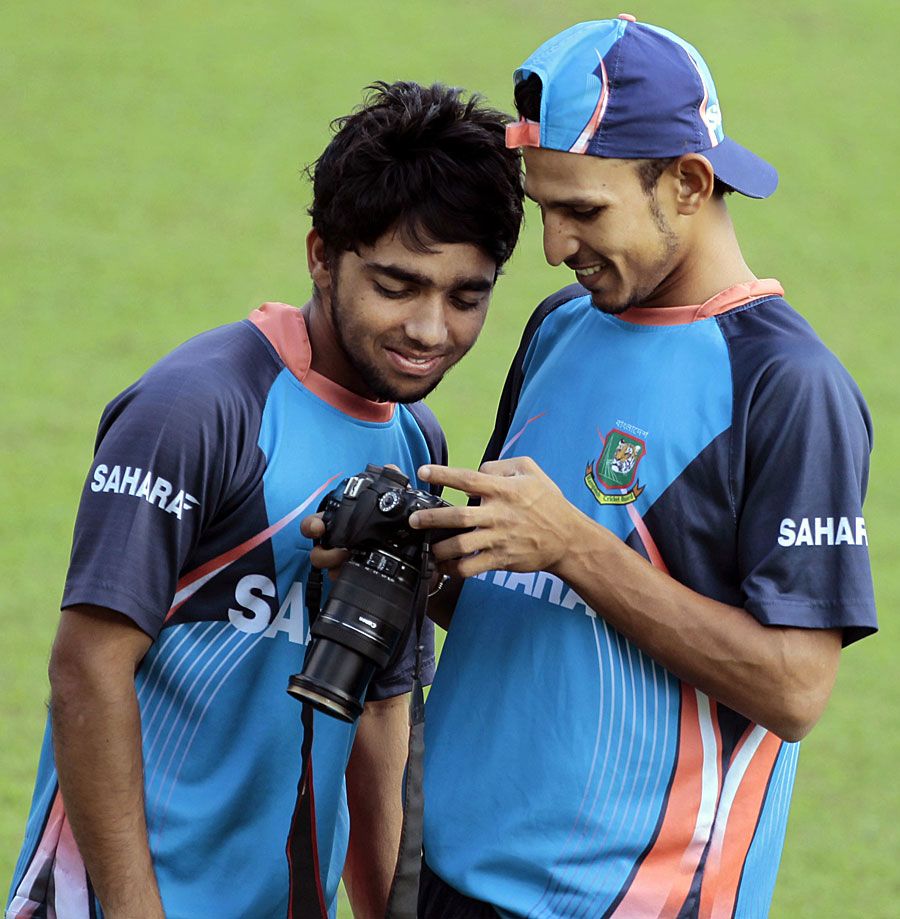 Mominul Haque and Nasir Hossain play around with a camera during training | ESPNcricinfo.com