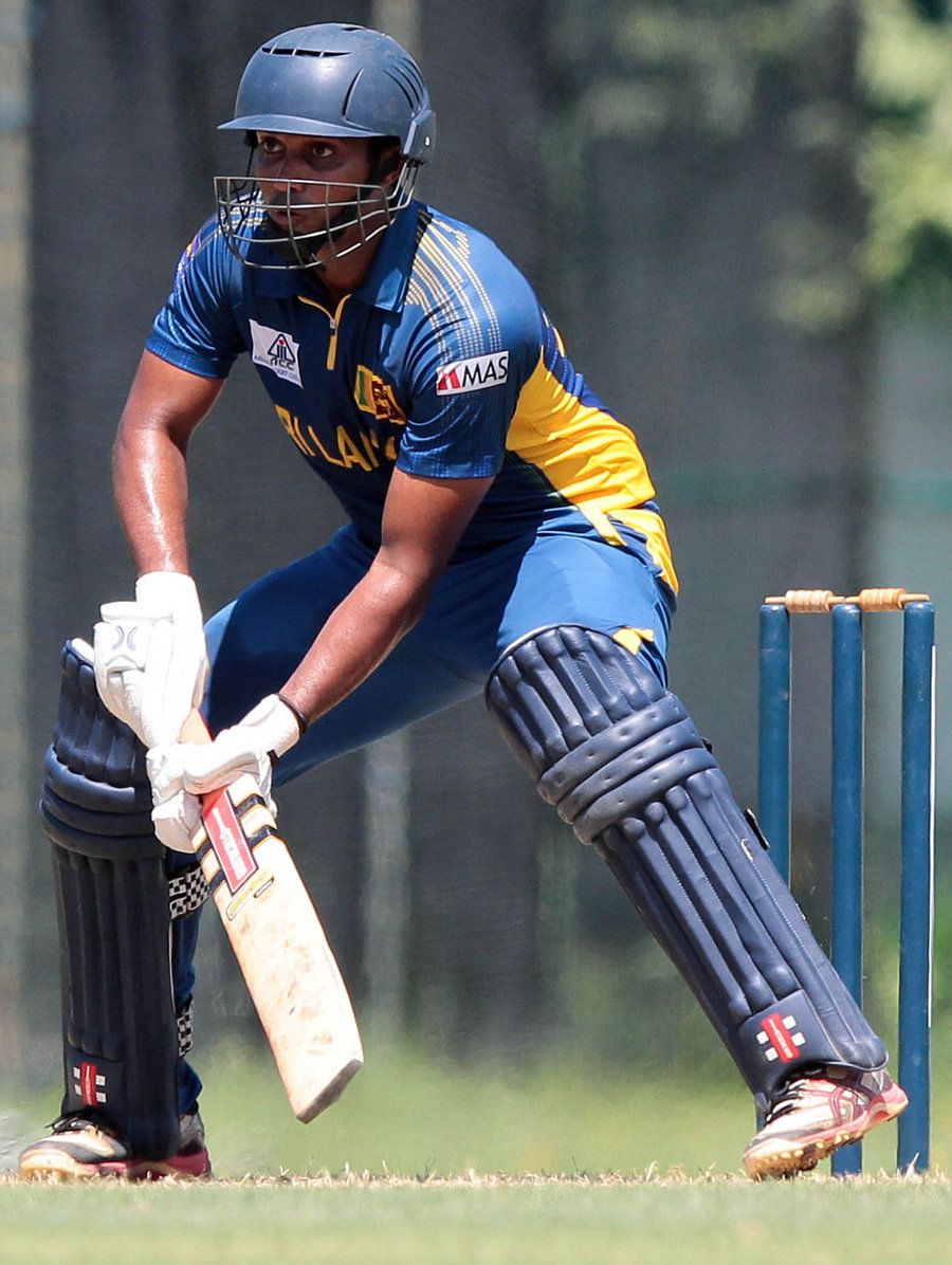 Danushka Gunathilaka prepares to hit through the leg side on his way to ...