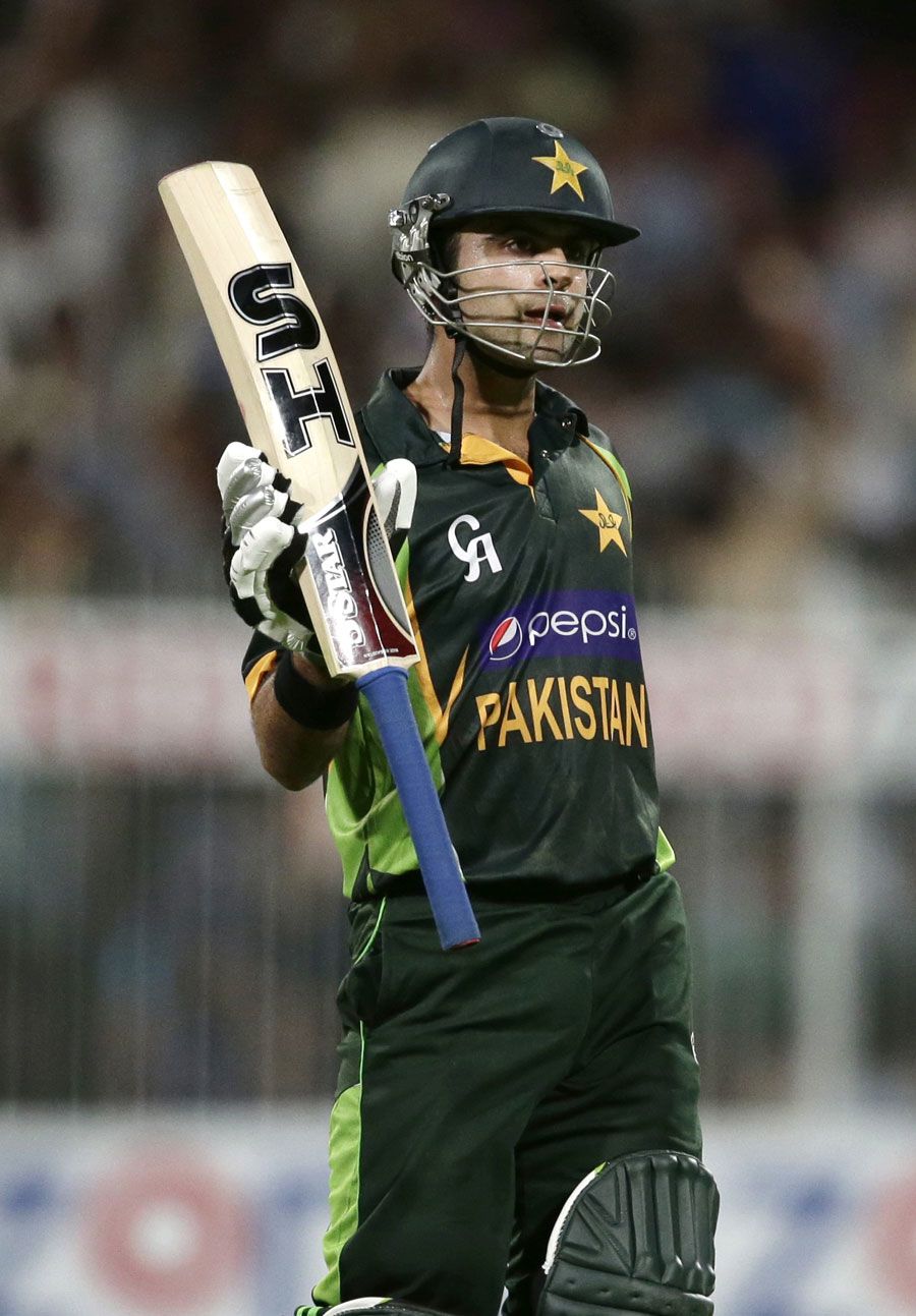 Ahmed Shehzad raises the bat after reaching his fifty | ESPNcricinfo.com