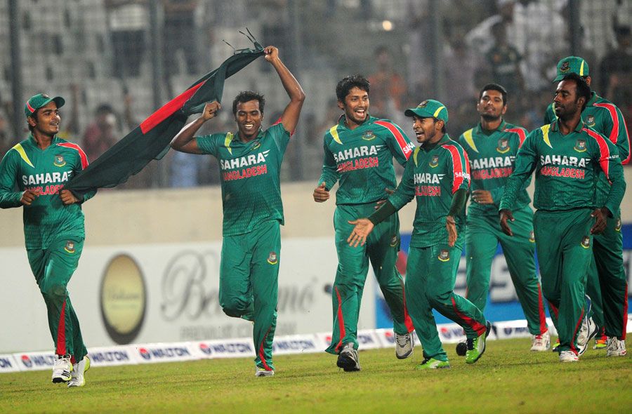 The Bangladesh players take a victory lap to celebrate their win ...