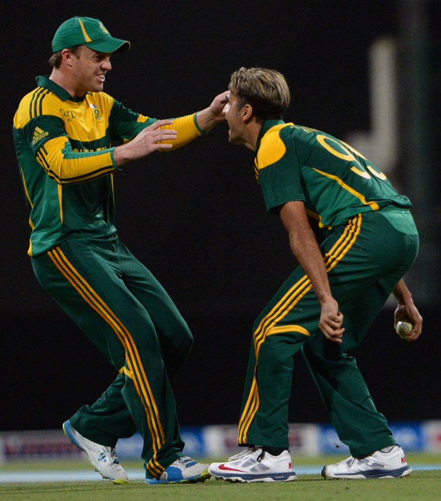 Imran Tahir and AB de Villiers are elated after Umar Akmal's dismissal ...