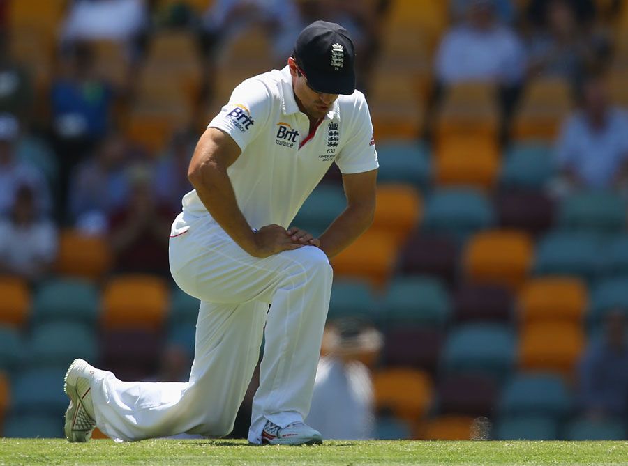 On their knees: Alastair Cook's team were flayed around the Gabba ...