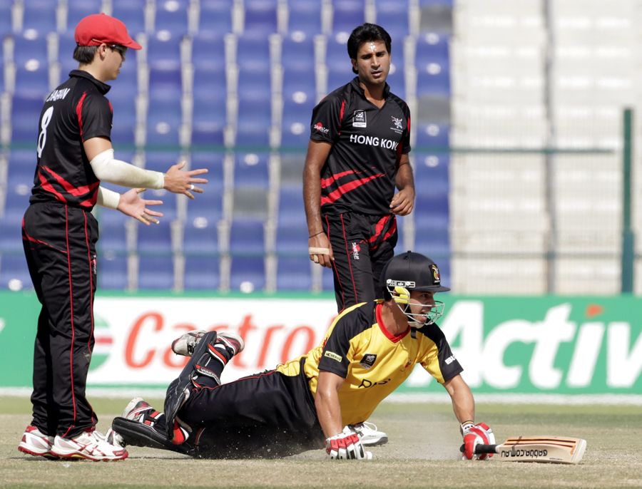 Chris Kent of PNG slides into his ground during the Papua New Guinea v ...