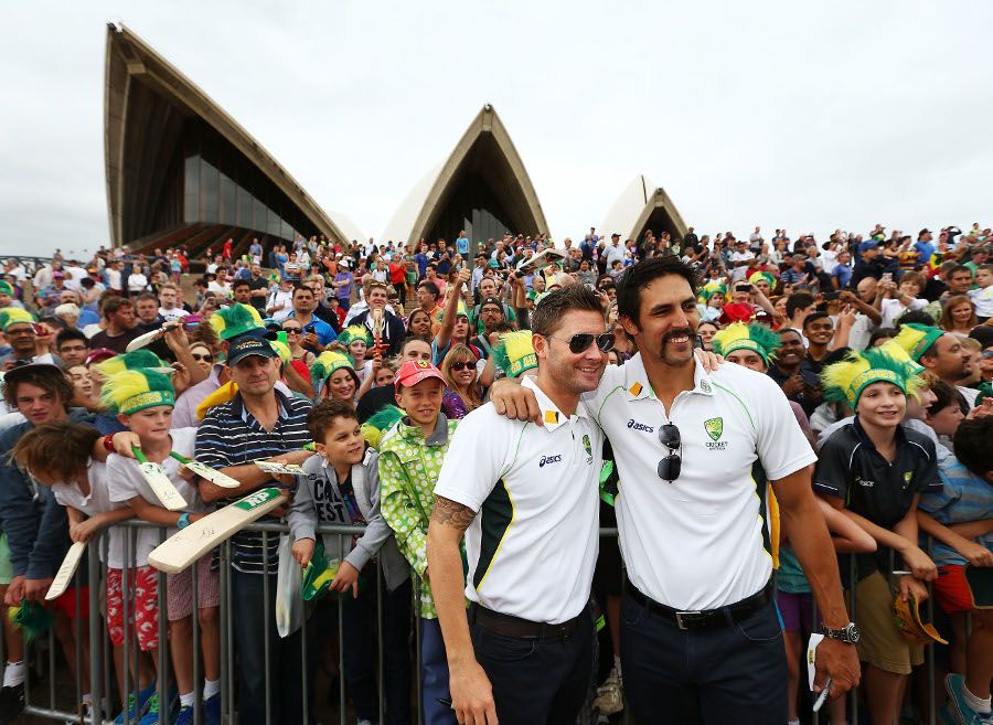 Michael Clarke and Mitchell Johnson pose in front of the fans and the ...