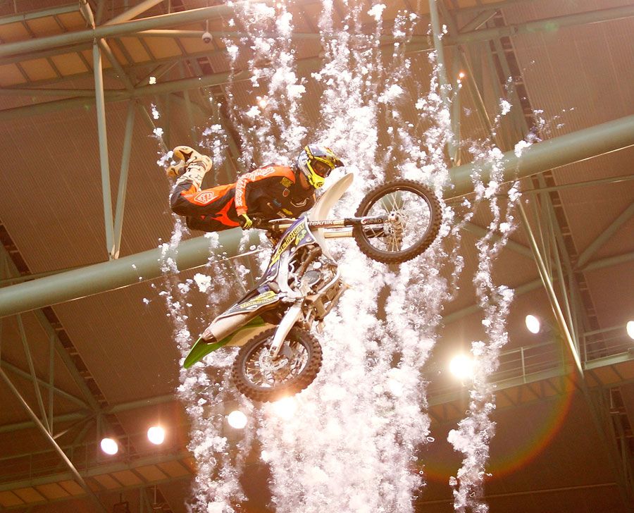 A motorcycle stunt rider against some fireworks | ESPNcricinfo.com