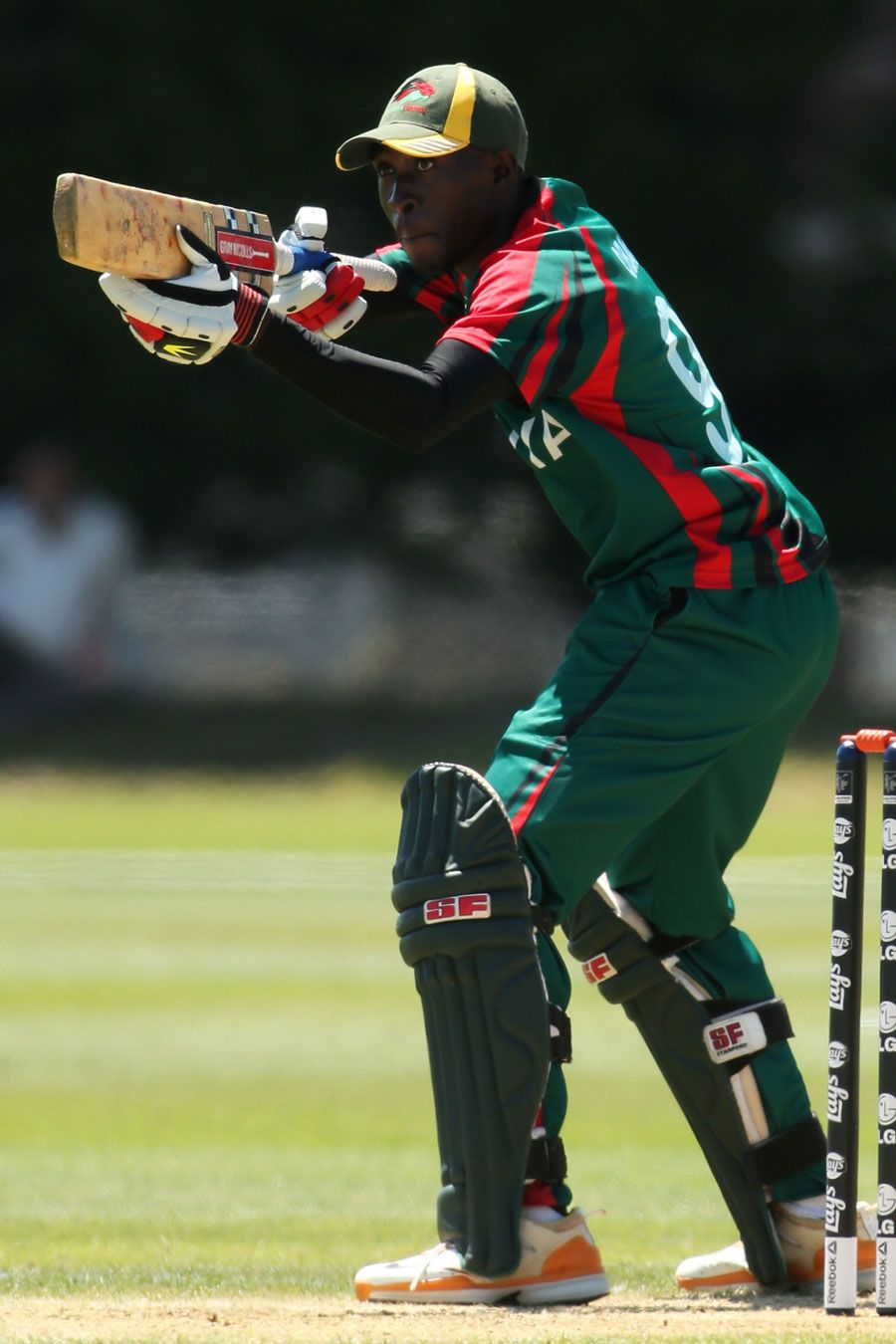 Alex Obanda celebrates after scoring a fifty | ESPNcricinfo.com