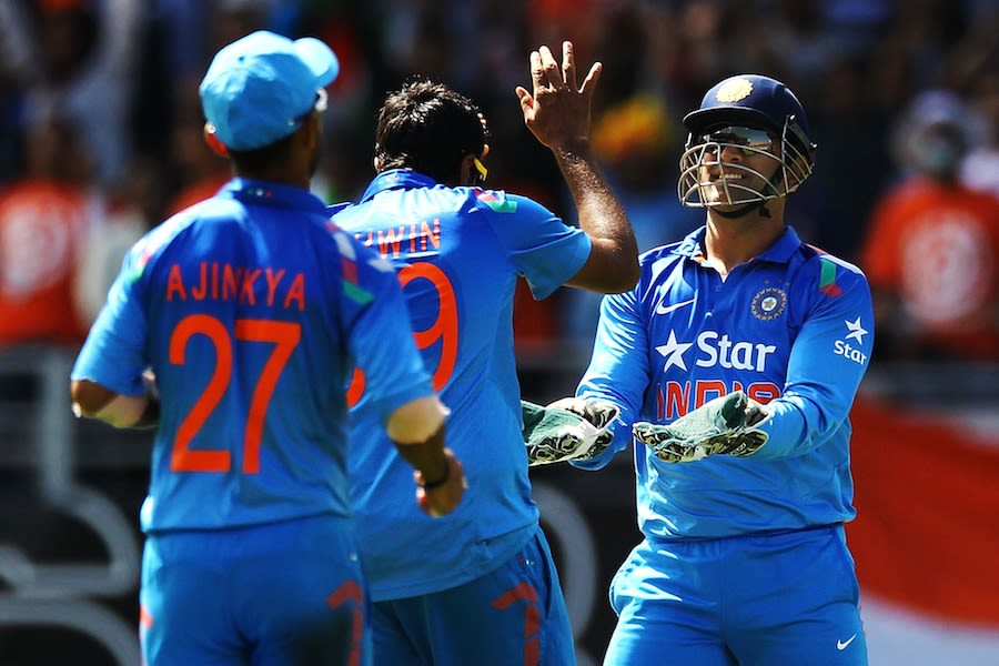R Ashwin celebrates with MS Dhoni after dismissing Corey Anderson ...