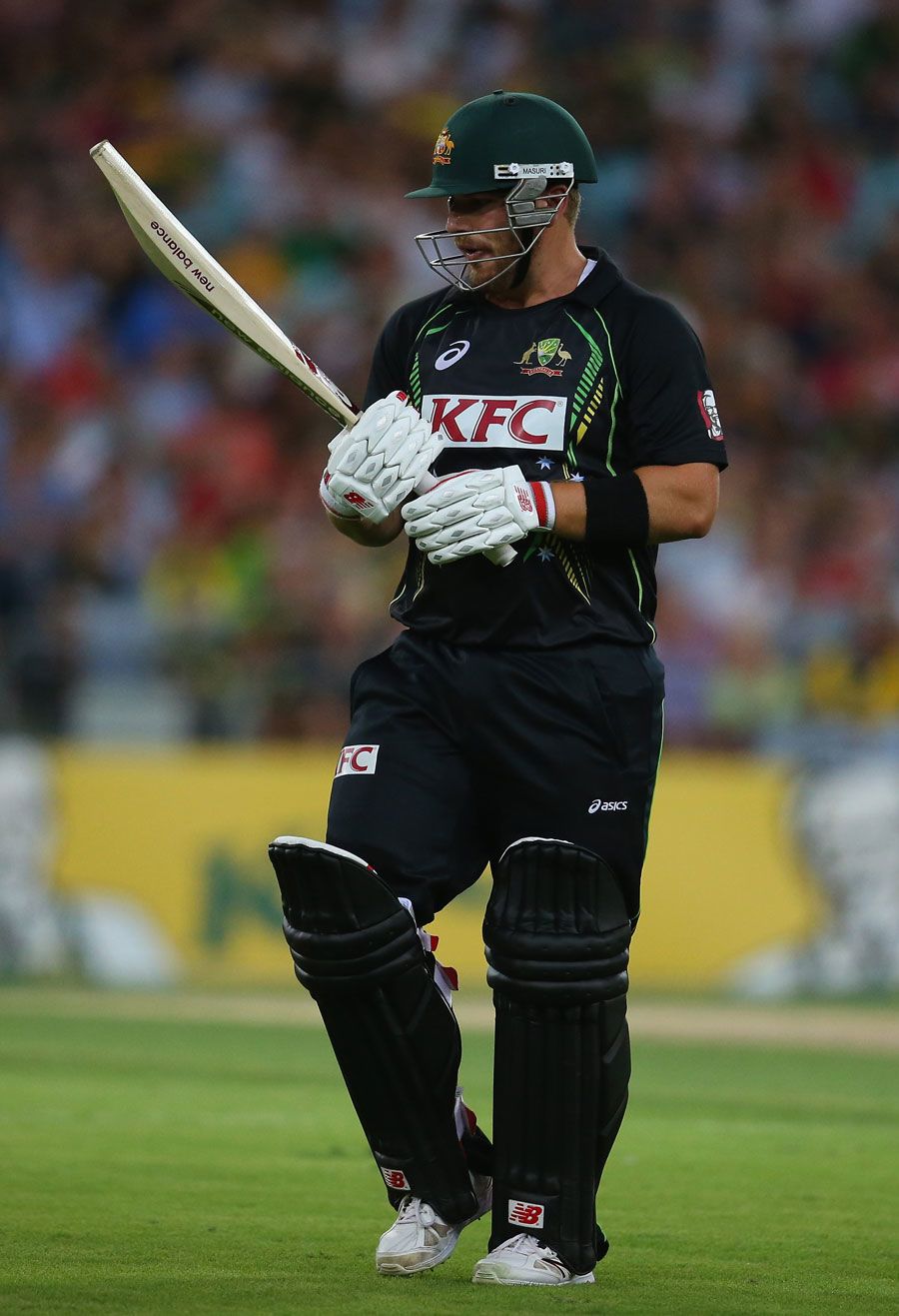 Aaron Finch examines his bat after falling to a miscue | ESPNcricinfo.com