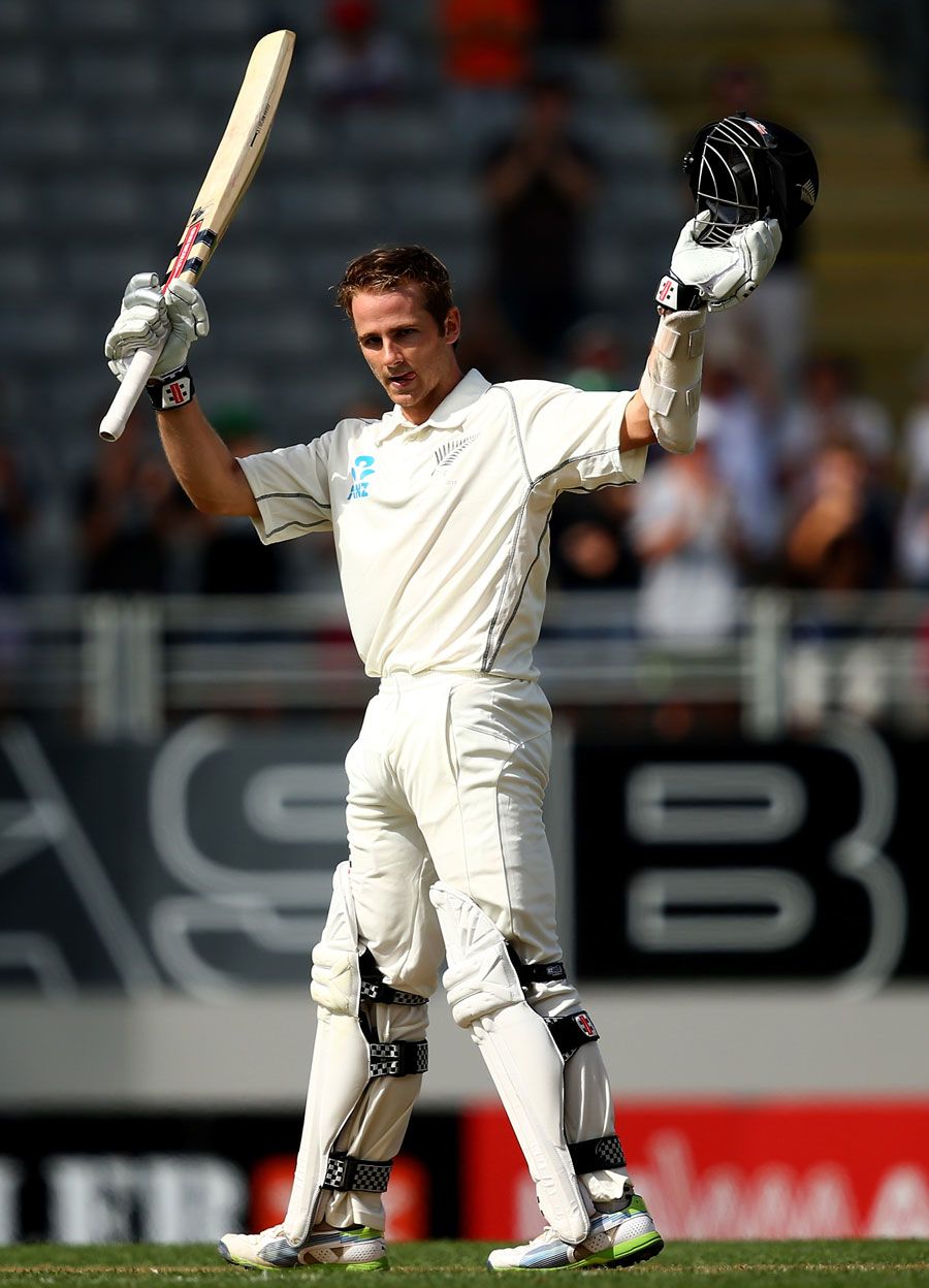 Kane Williamson raises the bat after reaching his hundred ...