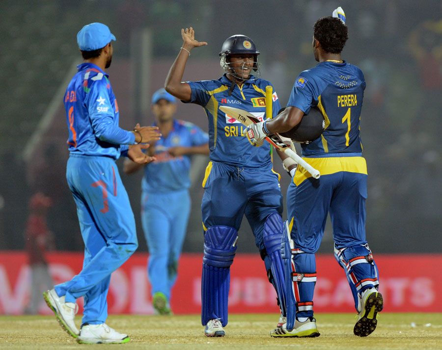 Thisara Perera and Ajantha Mendis poised for a high five | ESPNcricinfo.com