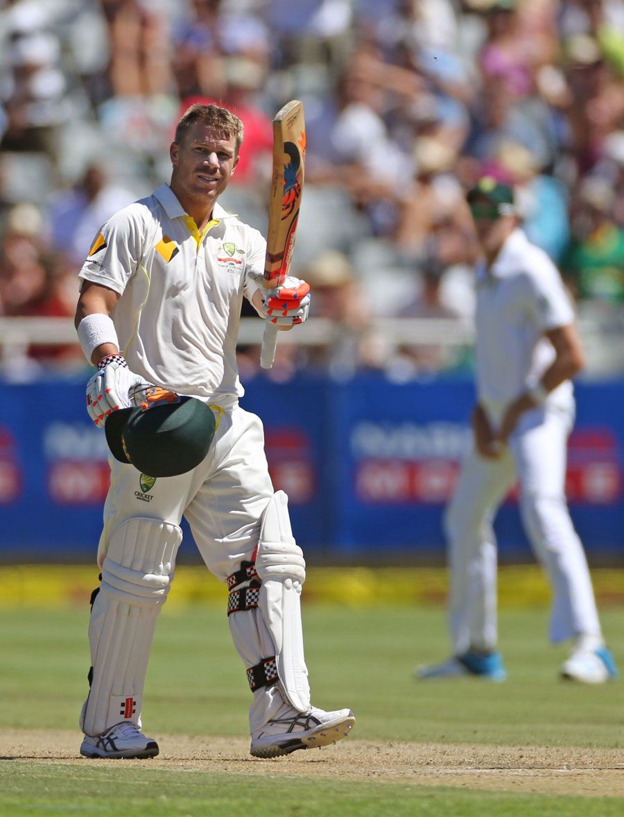 David Warner holds up the bat after making hundred | ESPNcricinfo.com