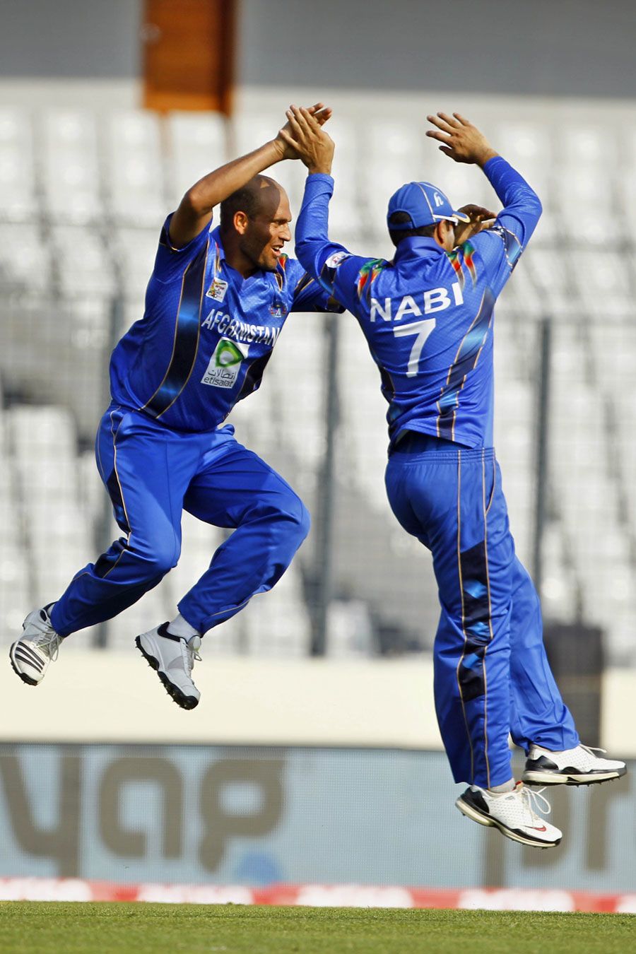 Mirwais Ashraf and Mohammad Nabi leap in celebration | ESPNcricinfo.com