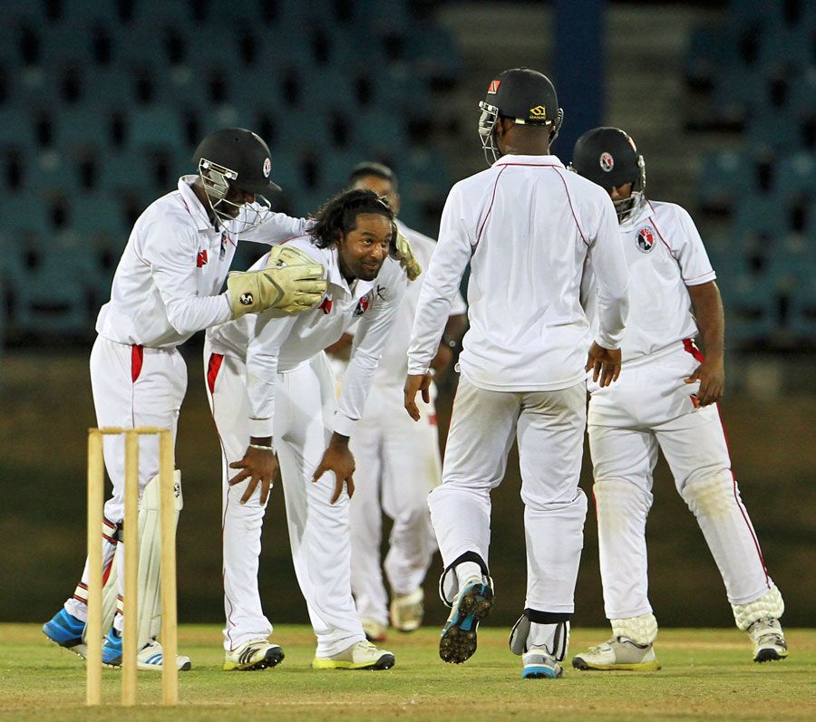 Team-mates congratulate Imran Khan after he took a wicket ...