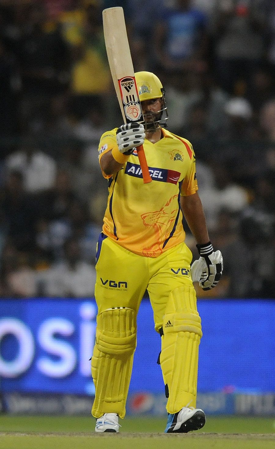 Suresh Raina raises the bat after reaching his fifty | ESPNcricinfo.com