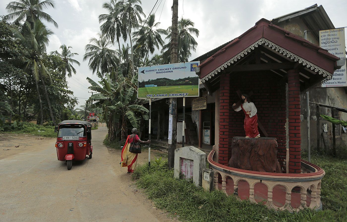 A signboard pointing to the Surrey Village Ground in Maggona ...