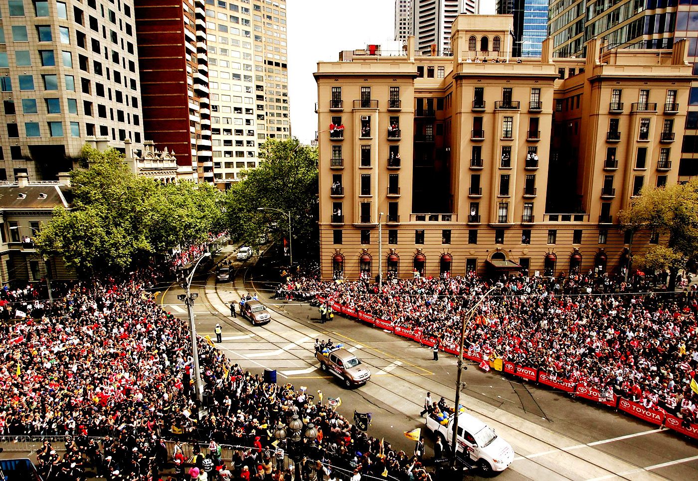 A large crowd gathers at Spring Street to watch the AFL Grand Final ...