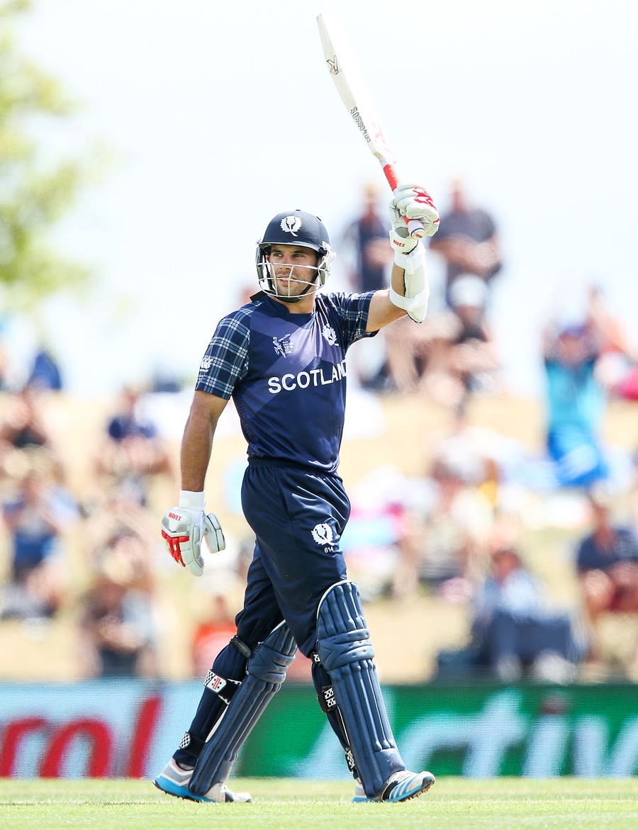 Kyle Coetzer acknowledges the cheers as he walks back after a century ...