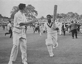 Basil Butcher leaves the field after scoring an unbeaten 129 against ...