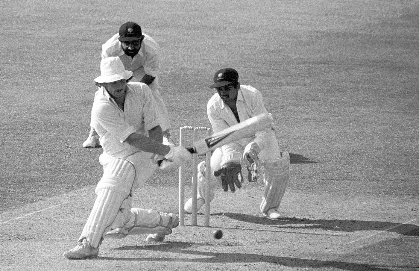 Ian Botham sweeps as wicketkeeper Bharat Reddy looks on | ESPNcricinfo.com