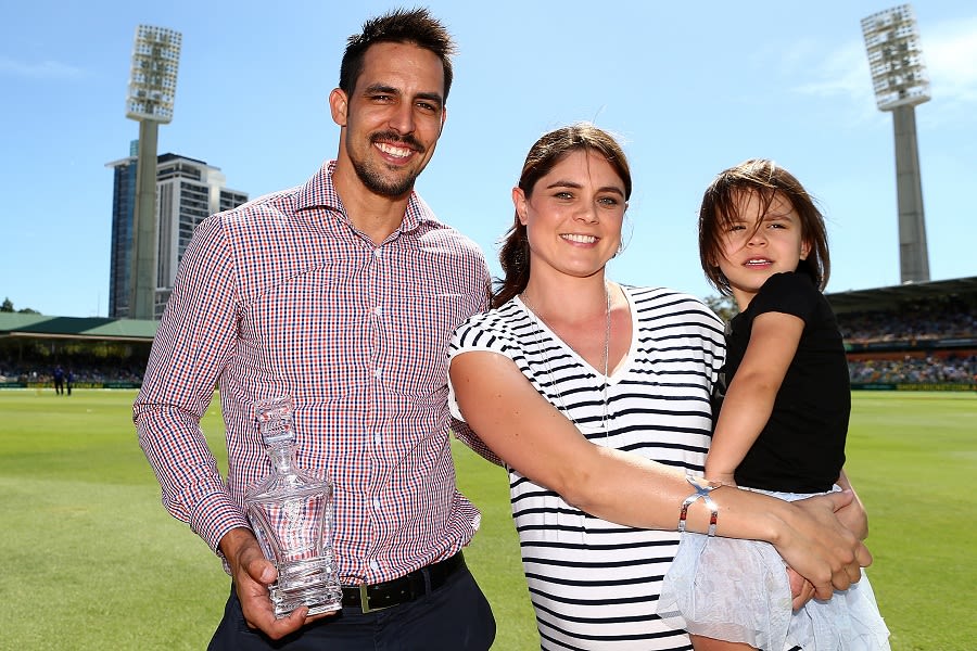 Mitchell Johnson poses with his family after he was ferried across the ...