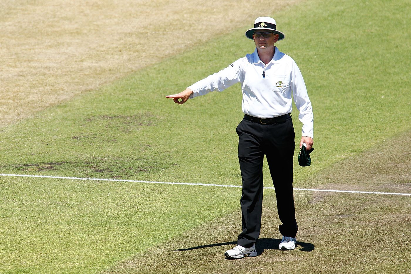 Umpire Sam Nogajski signals a four | ESPNcricinfo.com