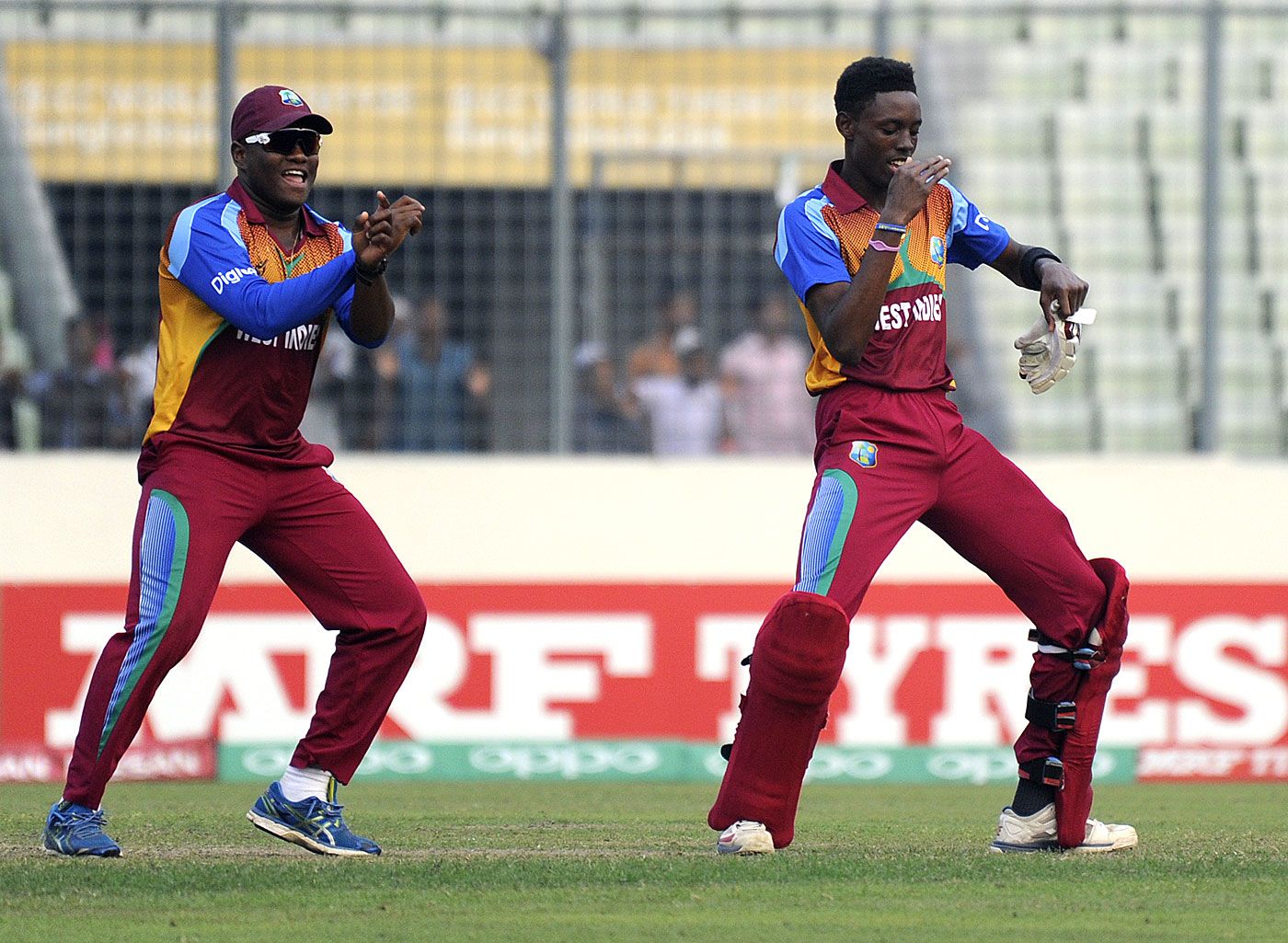 Gidron Pope and Shamar Springer celebrate after the semi-final win ...