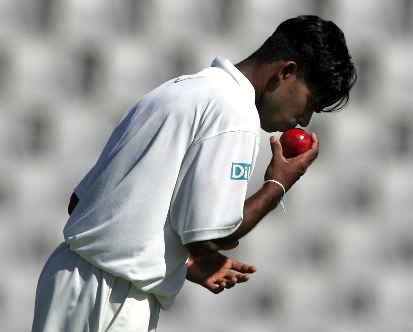 Lasith Malinga of Sri Lanka kisses the ball at the top of his mark ...