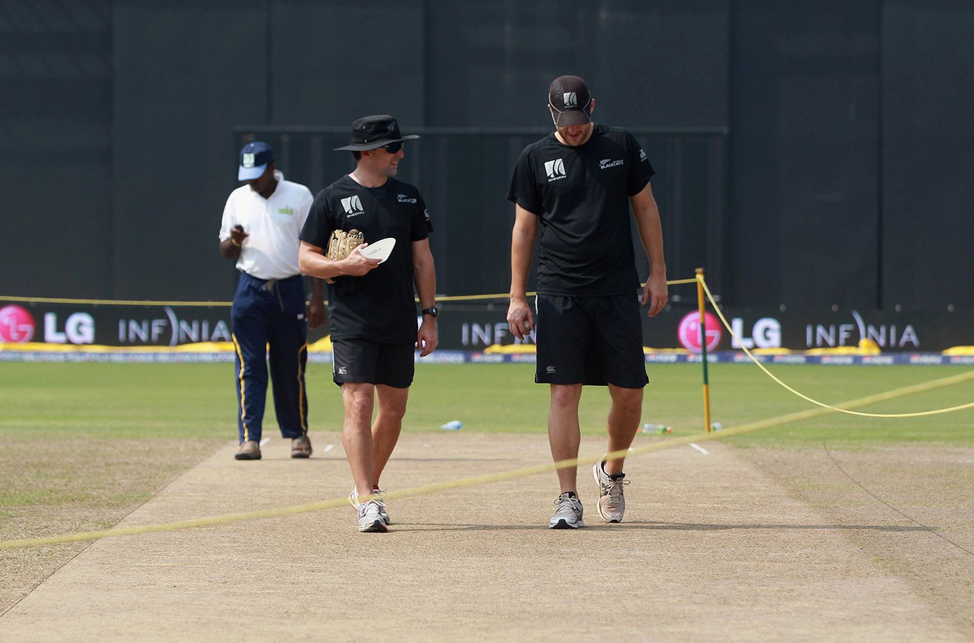 Trent Woodhill and Daniel Vettori walk on the pitch | ESPNcricinfo.com