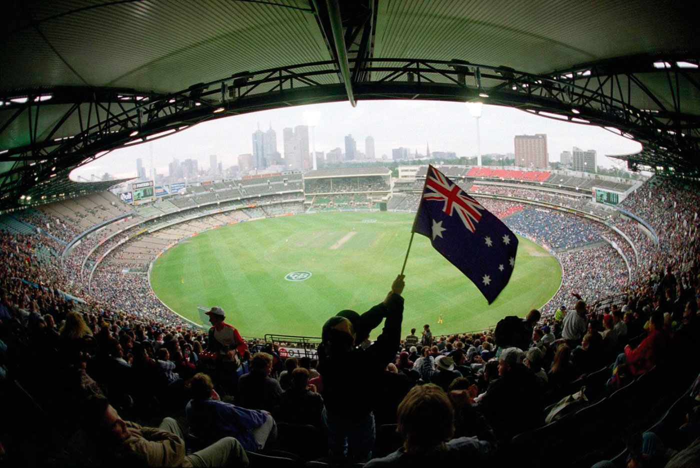 A fan waves the Australian flag high up in the stands | ESPNcricinfo.com