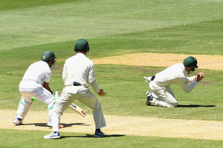 Peter Handscomb holds on to a catch at short leg to dismiss Asad Shafiq ...