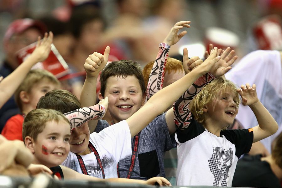 The children's section of the crowd gesture to the camera ...