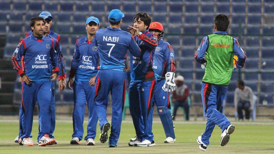 Rashid Khan gets a high five from Mohammad Nabi after dismissing Kevin ...