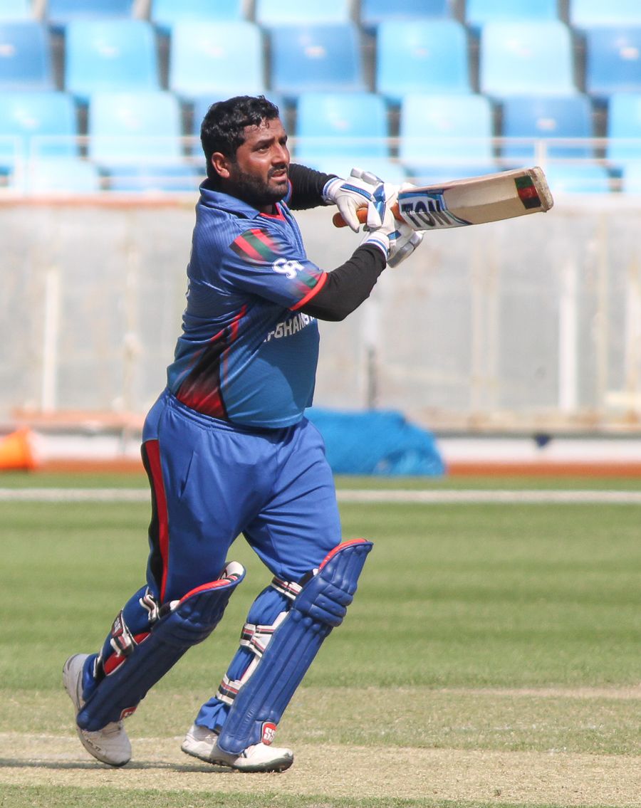 Mohammad Shahzad scoops a single down the ground during his 80 ...