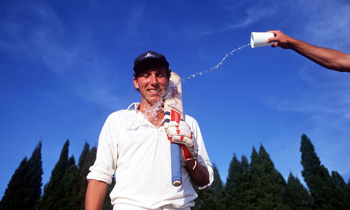 Derek Pringle throws a glass of water on Mike Atherton | ESPNcricinfo.com
