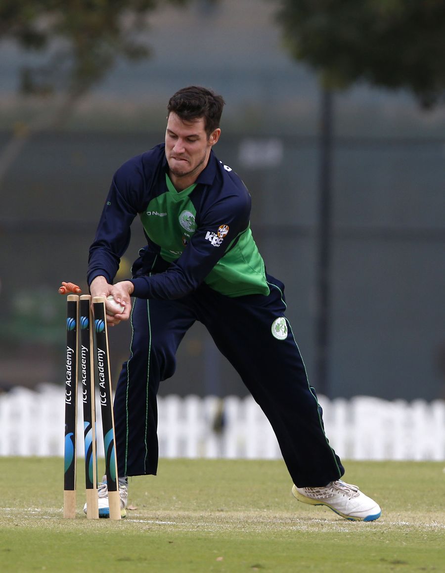 George Dockrell takes the bails off to run out Shaiman Anwar ...