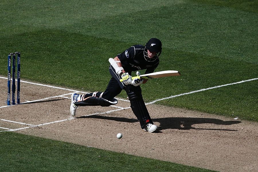 Mitchell Santner puts in a big stride to flick into the leg side ...