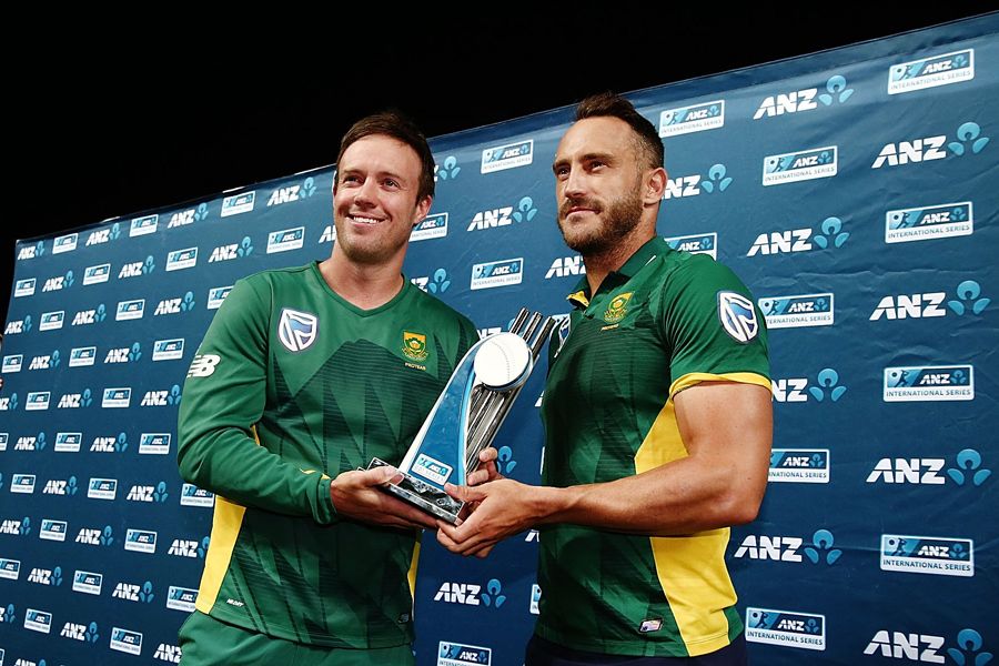 South Africa's ODI and Test captains pose with the trophy ...