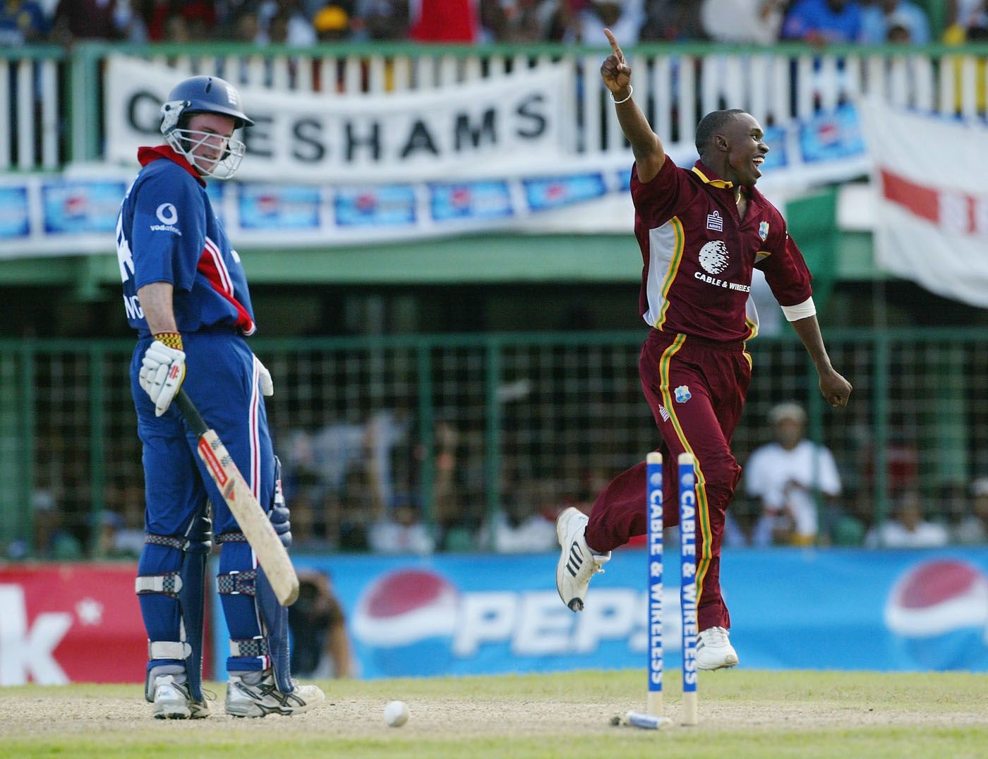 Andrew Strauss looks back disbelievingly after being castled by Dwayne ...