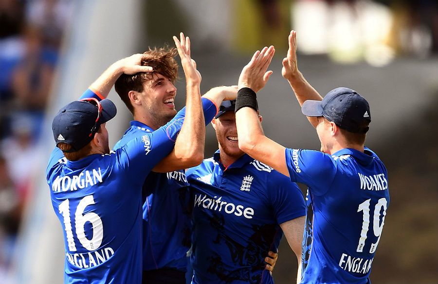 Steven Finn celebrates with his team-mates after claiming Kieran Powell ...