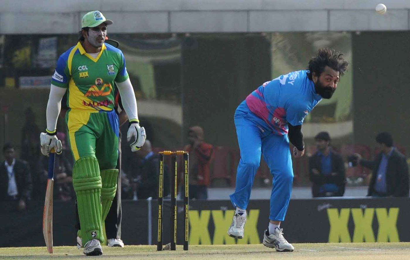 Bollywood actor Bobby Deol bowls in a Celebrity Cricket League match in ...
