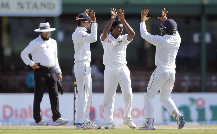 Lakshan Sandakan celebrates with team-mates after dismissing Soumya ...