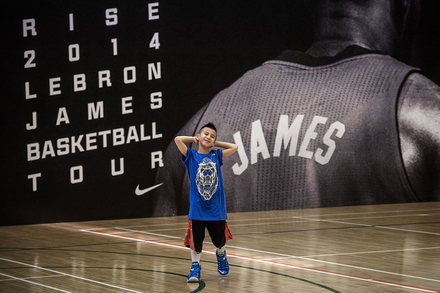 A kid waits to meet LeBron James at a promotional event in Hong Kong ...