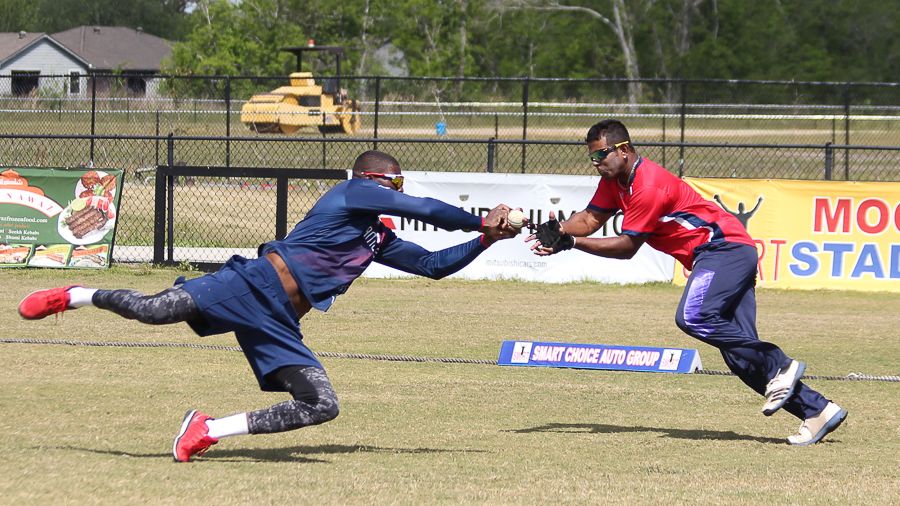 Timroy Allen dives across Roy Silva to take a diving slips catch during ...