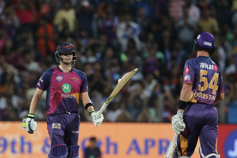 Steven Smith raises his bat after notching up his half-century ...