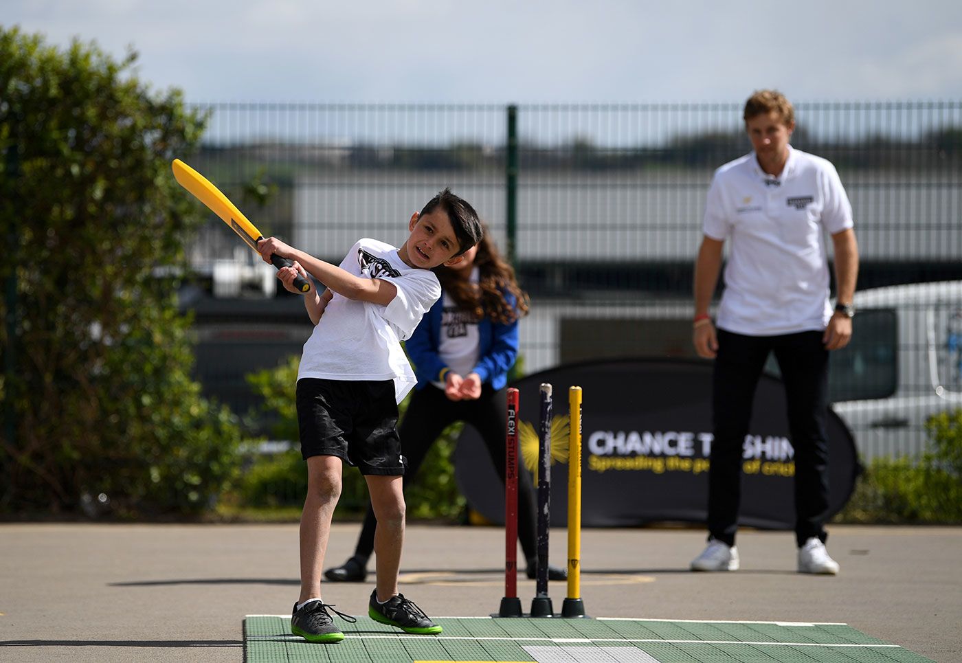 Joe Root coaches school children during a visit to his former school ...