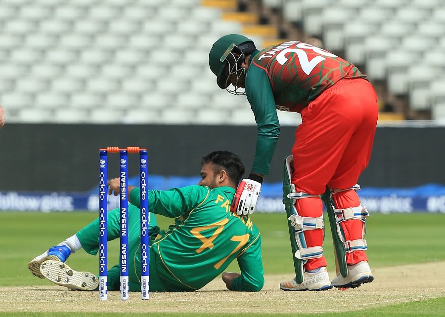 Fahim Ashraf is helped up Tamim Iqbal | ESPNcricinfo.com