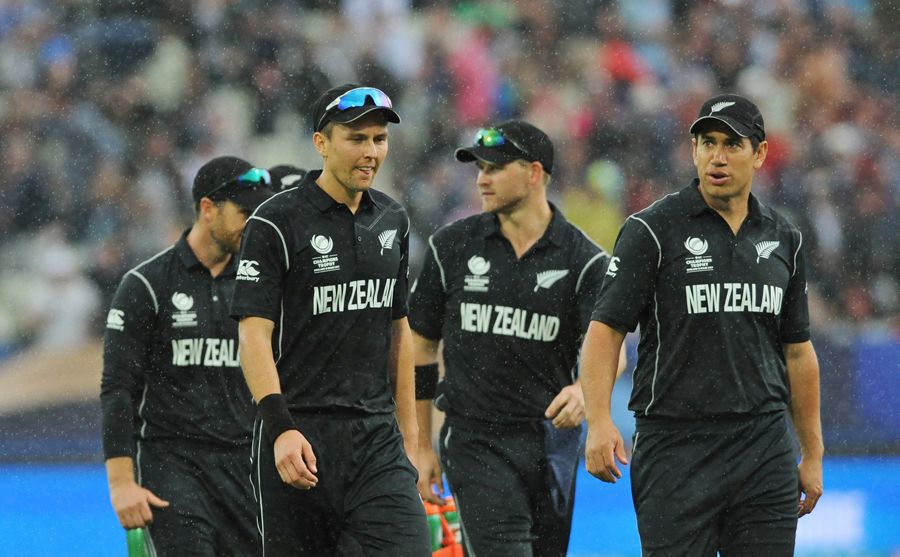 The New Zealand players walk back to the pavilion before rain effected ...