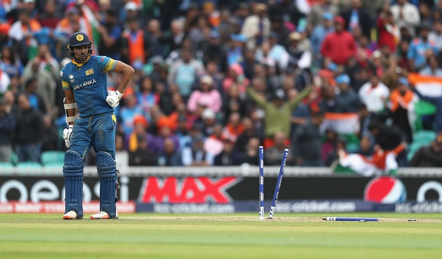 Danushka Gunathilaka was caught short of his ground by a throw from ...