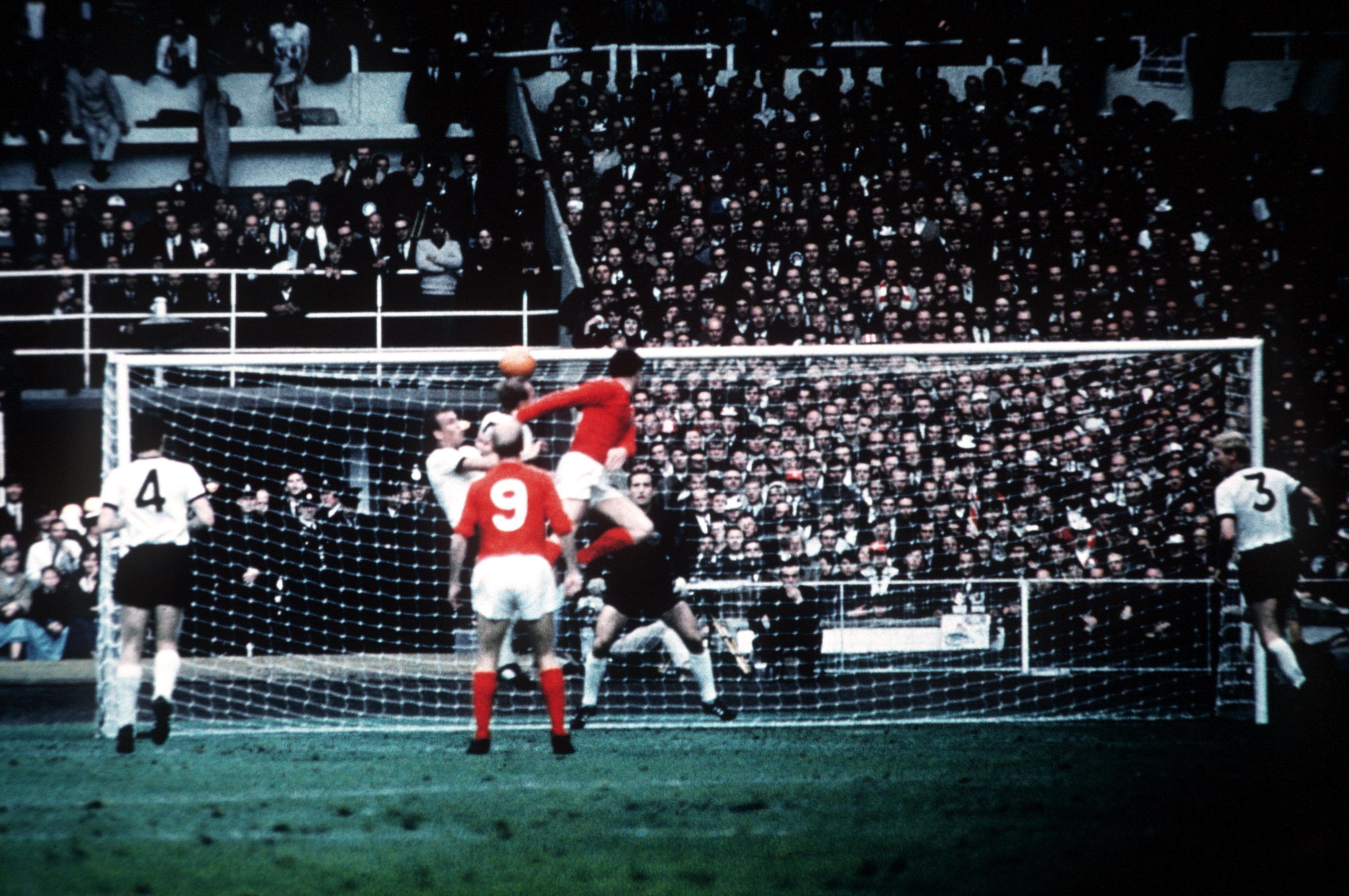 Geoff Hurst heads home his infamous third goal in the 1996 World Cup ...